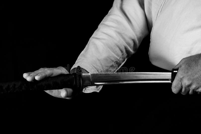 Samurai Warrior Takes Out His Sword from Its Scabbard Stock Image ...