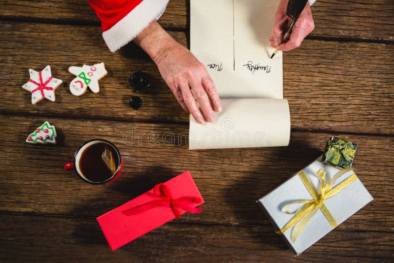 Santa Claus Writing on Scroll Stock Image - Image of holiday, coffee ...