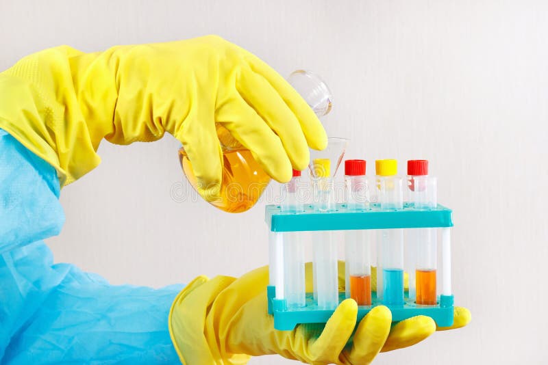 Hands of Scientist in Rubber Gloves Doing Chemical Analysis in ...