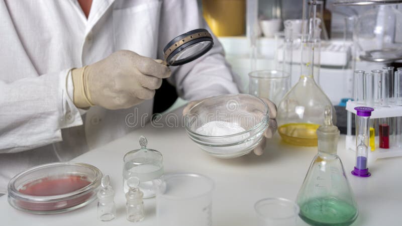 The Hands of a Scientist Working with Laboratory Samples of Nutritional ...