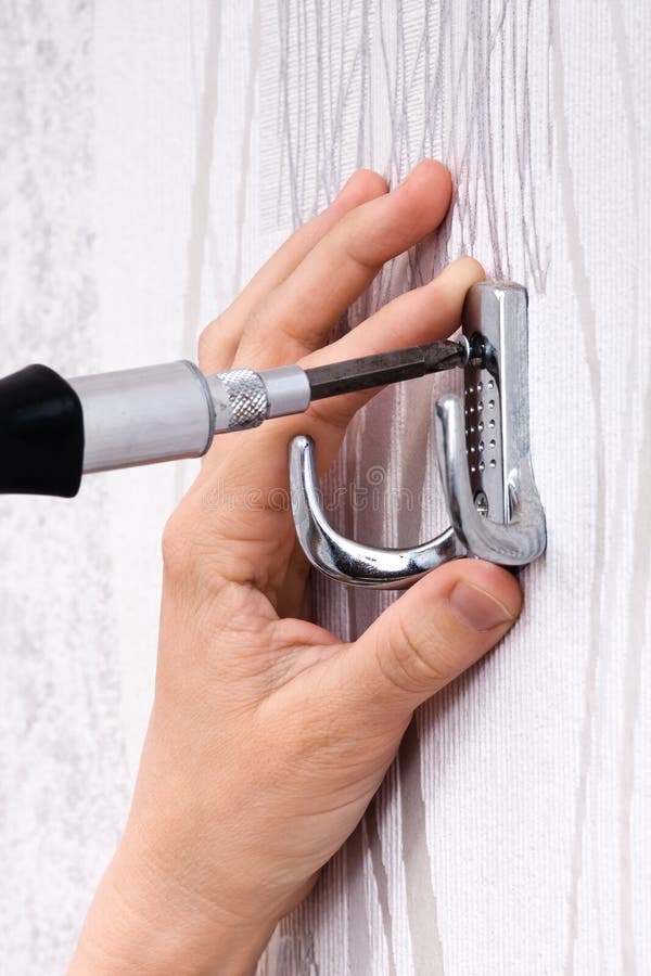 Hands Screwing Hook with Screwdriver Stock Photo - Image of hand ...