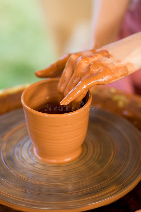 Hands Sculpts Cup from Clay Pot. Workshop of Modeling on Potter Wheel ...