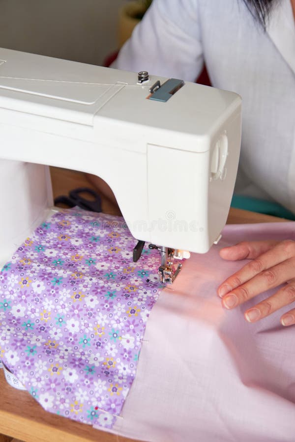 Hands of Seamstress Working on Sewing Machine Stock Image - Image of ...