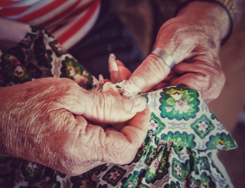 Hands that Sew stock image. Image of needle, hands, clothing - 152803711