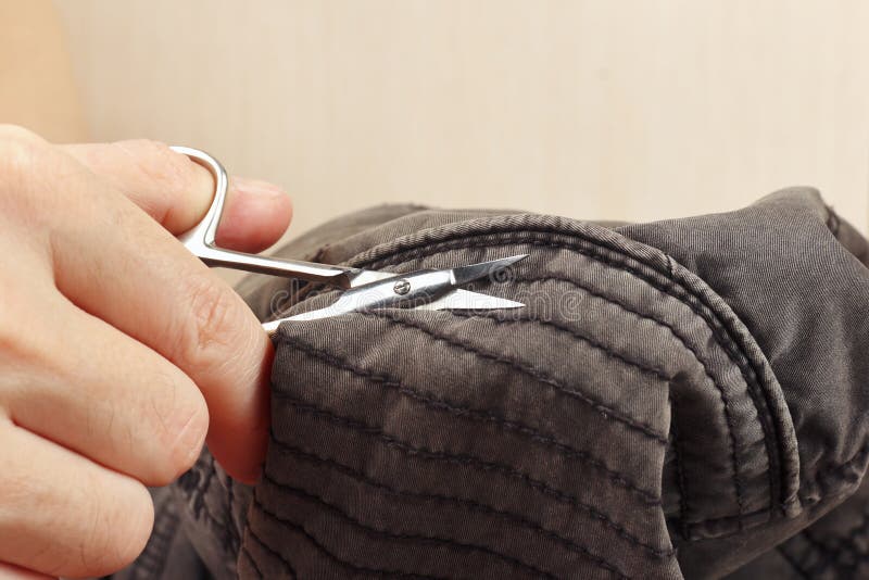 Hands of Sewer with a Pair of Scissors Cut Cotton Clothes Close Up ...