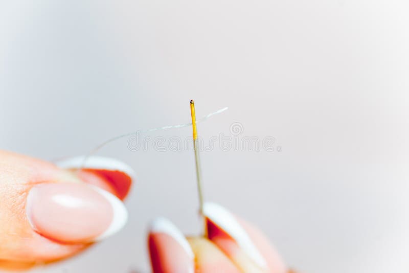 Hands are Sewing with Thread and Needle Stock Photo - Image of fashion ...