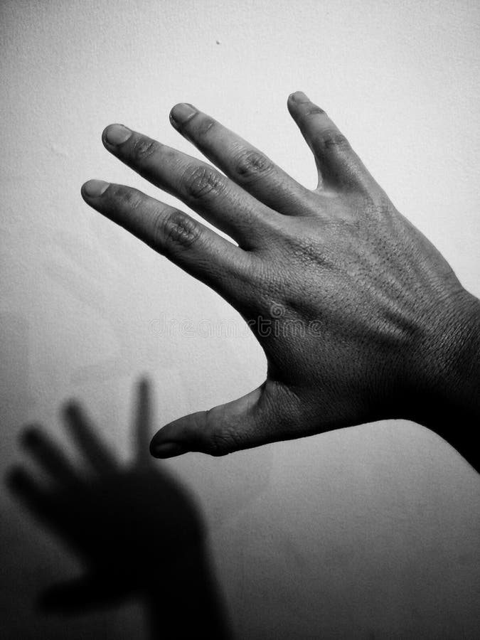 Hands, shadows and walls stock image. Image of person - 262656389