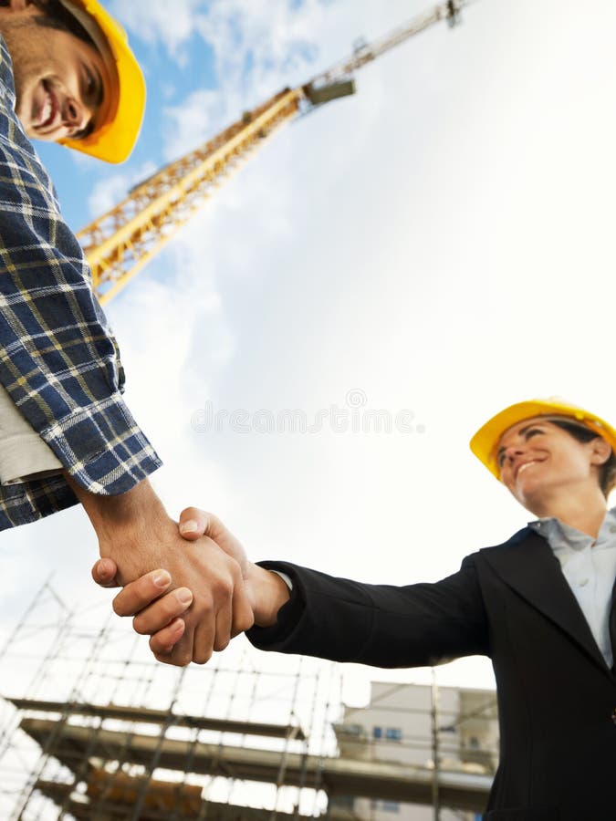 Construction Workers Shaking Hands Stock Image - Image of expertise ...