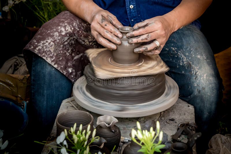 Hands shaping clay pot stock photo. Image of artistic - 85550694