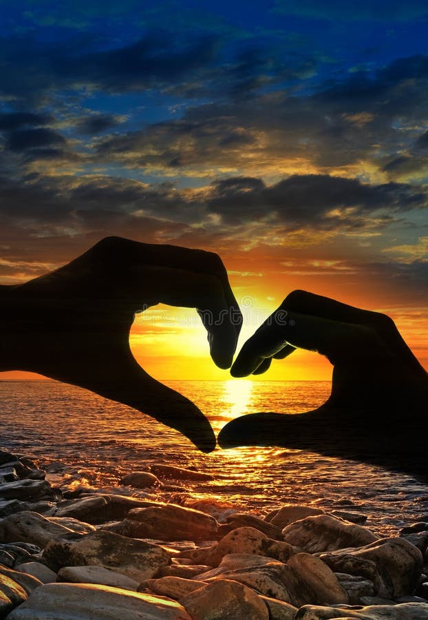 Sunset in heart hands stock image. Image of nature, recreation - 33939547