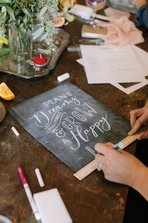 Creative Individual Designing a Chalkboard Sign with Inspirational ...