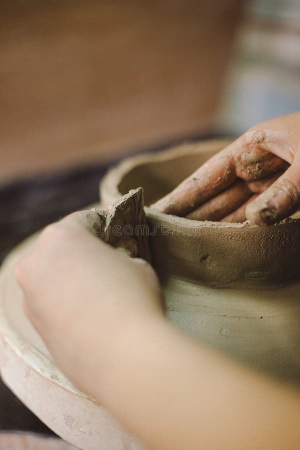 Hands Skillfully Shape a Clay Pot in a Pottery Studio Stock Image ...