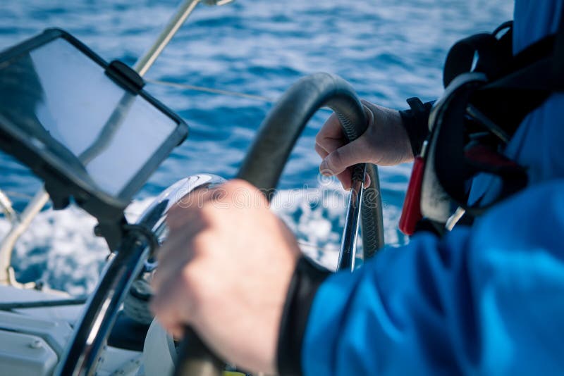 Hands of the Skipper at the Helm Control of Sailing Boat Stock Photo ...