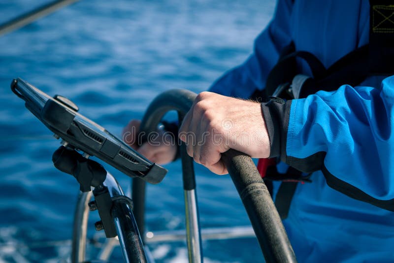 Hands of the Skipper at the Helm Control of Sailing Boat Stock Image ...
