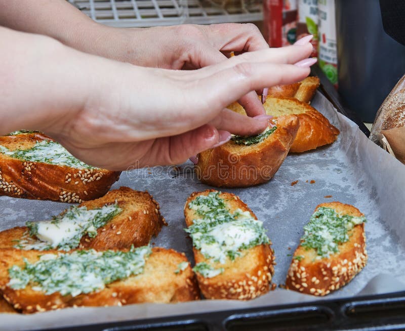 Hands are Spread with Freshly Prepared Garlic Bread, Herbs and Butter ...