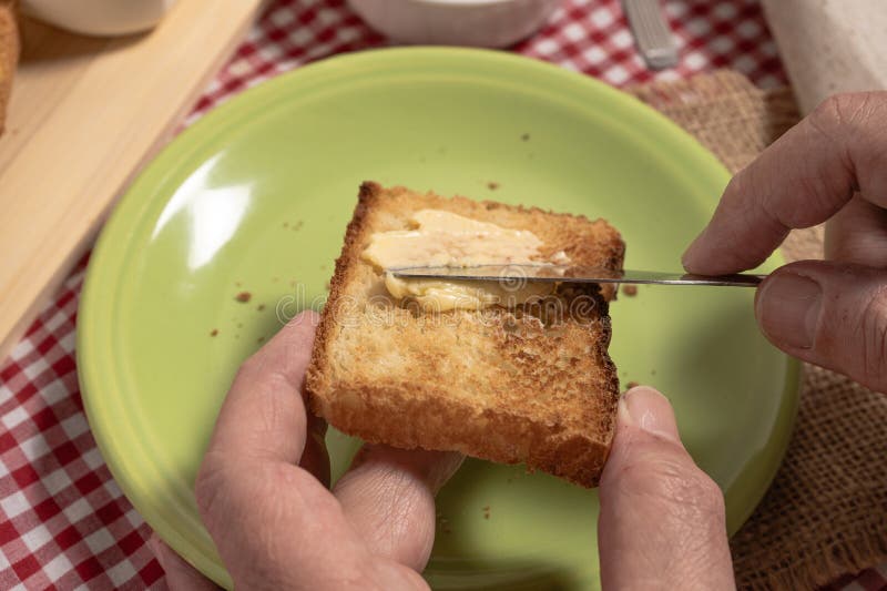 Chef Spreading Butter on Toasted Bread for Breakfast Stock Photo ...