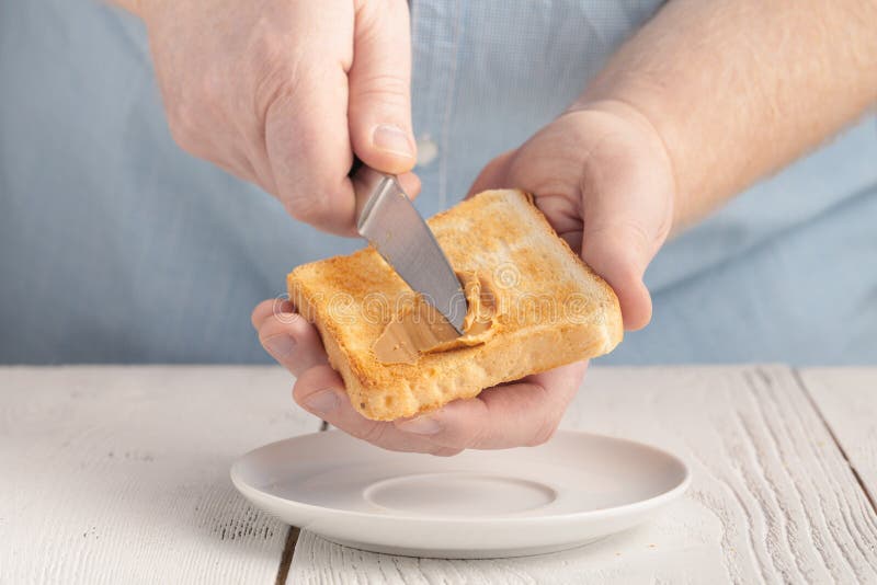Hands Spreading Peanut Butter on Wholemeal Toast Stock Image - Image of ...