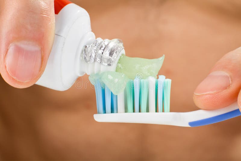 Hands Squeeze Toothpaste Onto a Toothbrush Stock Image - Image of human ...