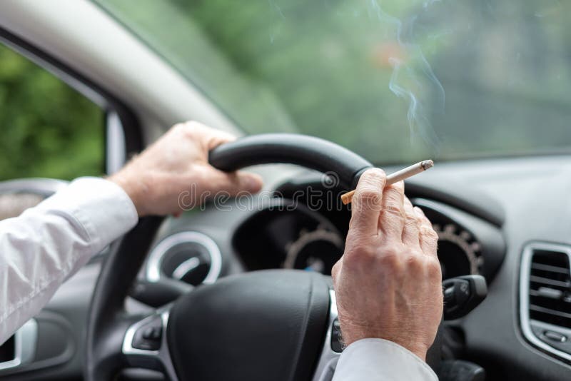 Smoking a Cigarette while Driving Stock Photo - Image of road, male ...