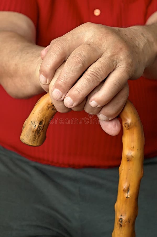 Hand holding a cane stock image. Image of aged, adult - 9649853