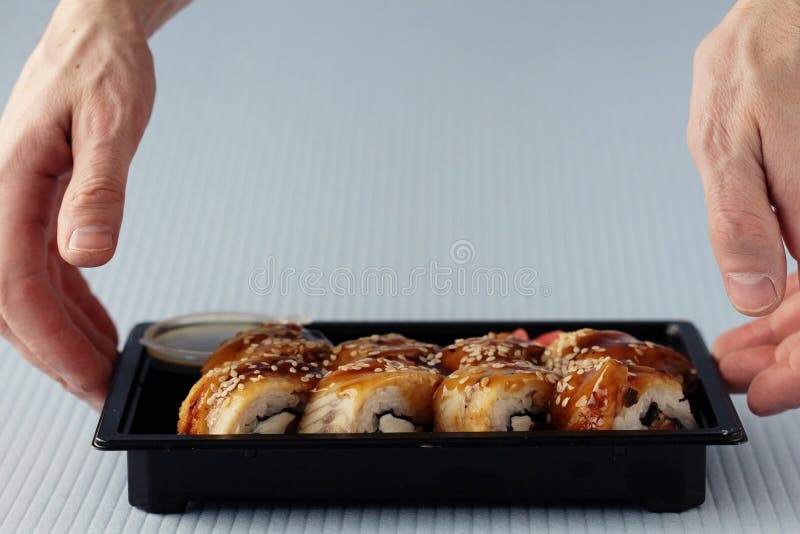 Hands sticks japan rolls stock image. Image of rice, delicious - 50327337
