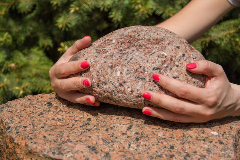 Hands on stone stock image. Image of tree, wristband - 71914639
