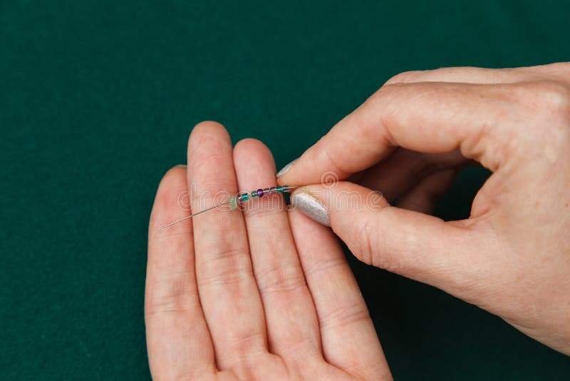 Hands Stringing Beads on a String. Needlework Stock Image - Image of ...