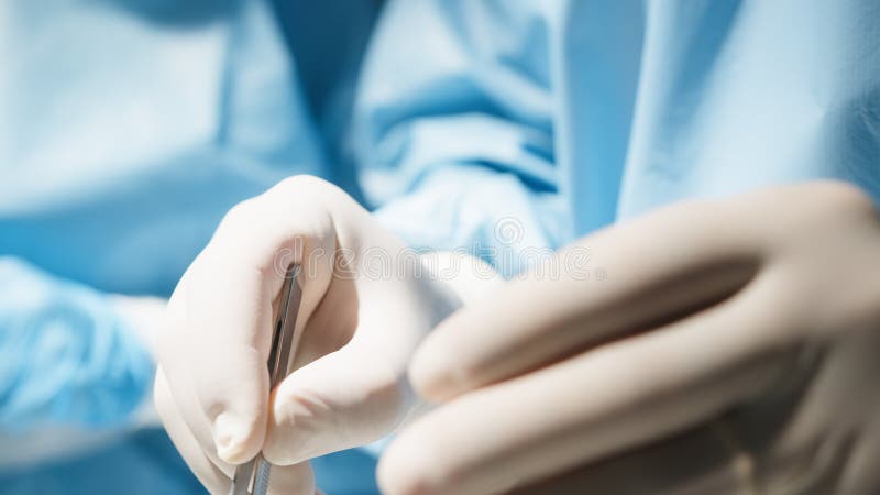Hands of a Surgeon Use Forceps and Scalpel during Stomach Operation ...