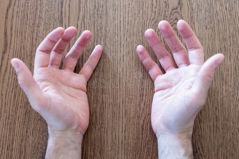 Hands on Table in a Pose To Simulate Holding Something. Hands Open and ...