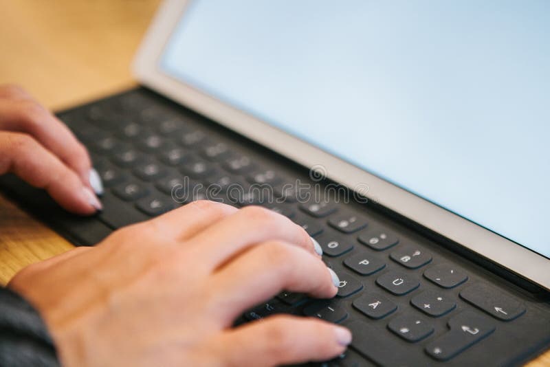 Hands on the Tablet Keyboard with German Letters. the Concept of Remote ...