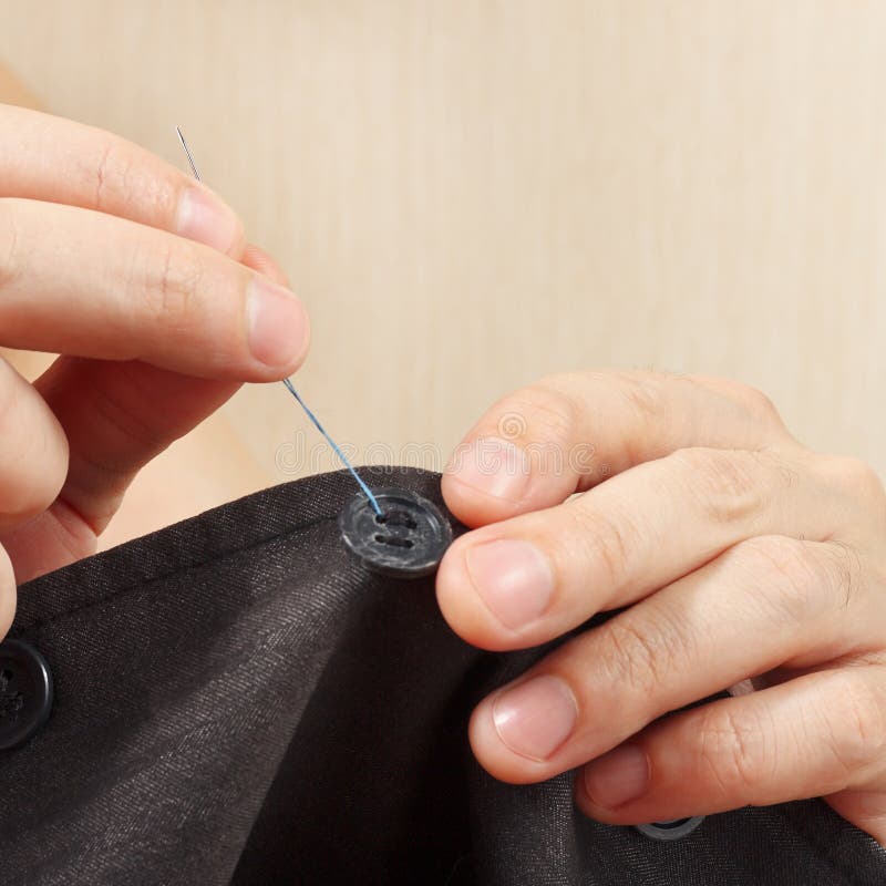 Hands of Tailor Sew a Button To Denim Fabric Close Up Stock Image ...