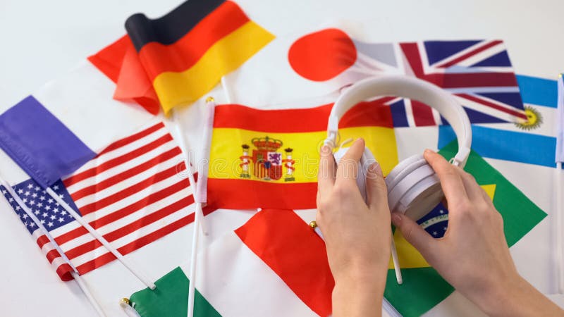 Hands Taking Headset, Different Countries Flags on Table, Language ...