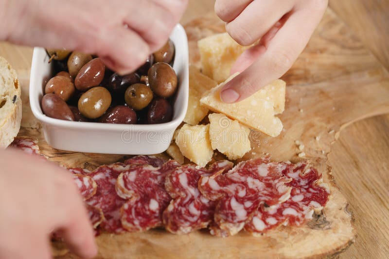 Hands Taking Italian Antipasti Appetizers on Table Stock Photo - Image ...