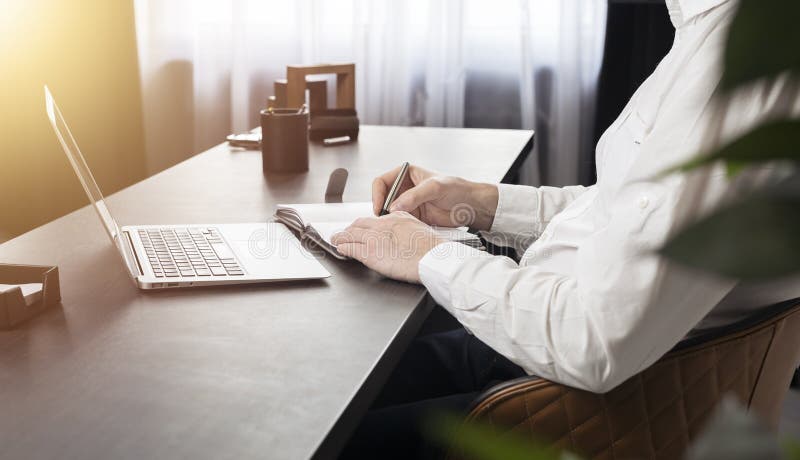 Hands Taking Notes, Writing in Planner at Office Desk with Laptop Stock ...