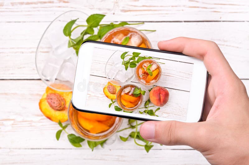 Hands Taking Photo Ice Tea with Peach with Smartphone. Stock Image ...