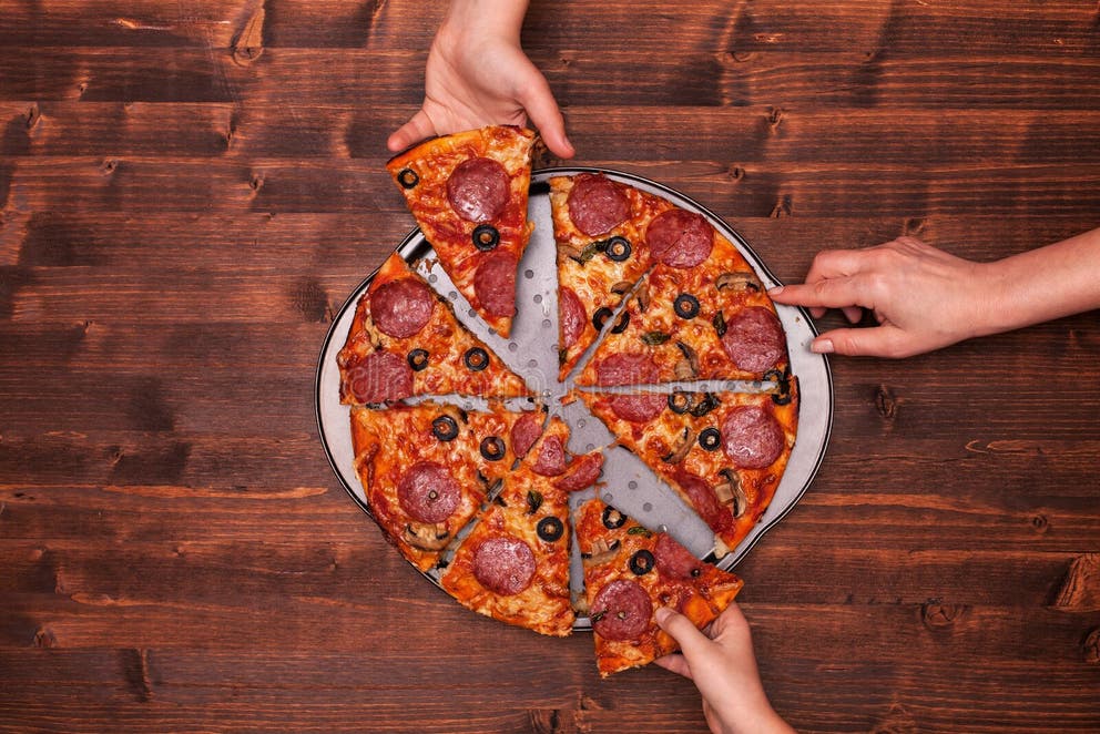Hands Taking Pizza Slices Off the Baking Pan Stock Photo - Image of ...