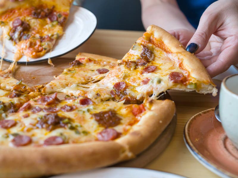 Appetizing Pizza Close Up and Hands with a Slice of Pizza Stock Photo ... Appetizing Pizza Close Up and Hands with a Slice of Pizza Stock Photo ...