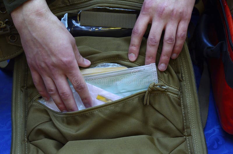 Taking Off the Protective Clothes. Woman Firefighter in Uniform is at ...