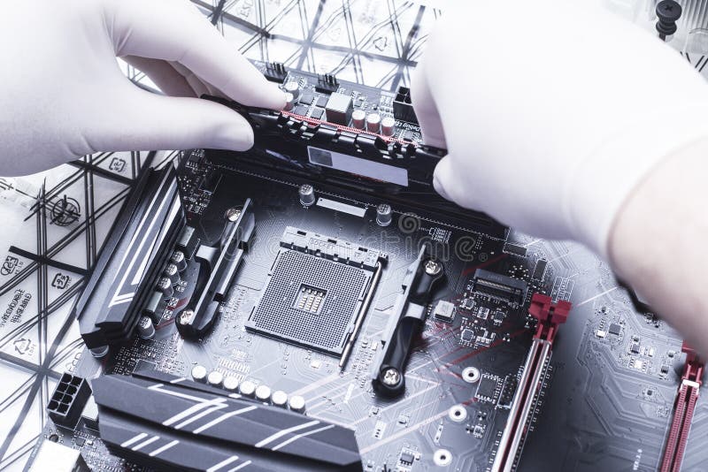 Hands Of A Technician Assembling Computer Hardware Parts New Cpu Is Being Mounted Unto The