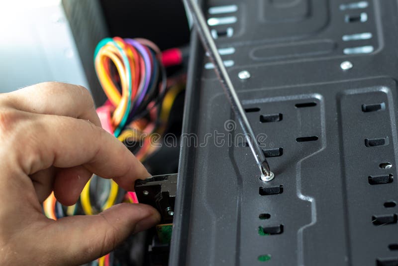 Hands of the Technician Repairing a Computer. Hardware Instalation ...