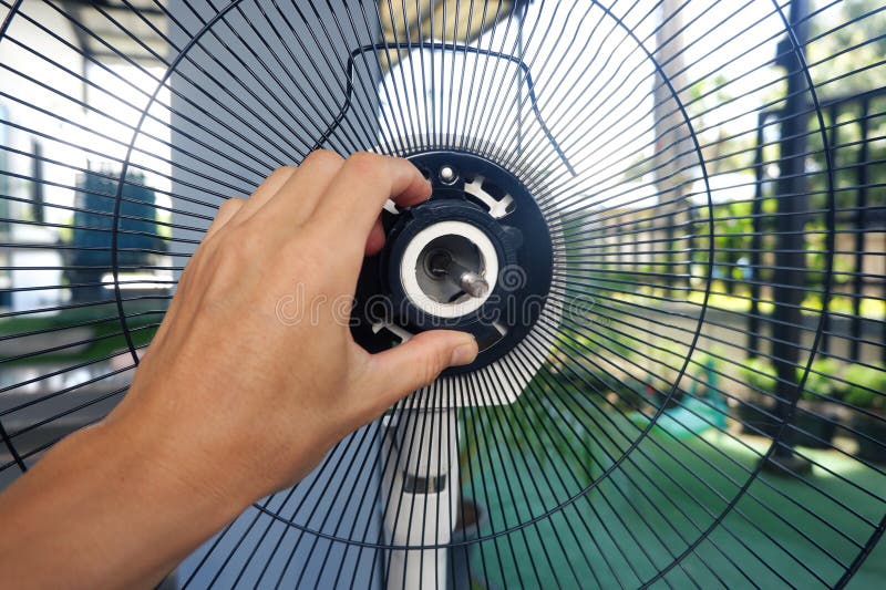 Hands of a Technician Repairing a Fan, Replacing Capacitors, Checking ...