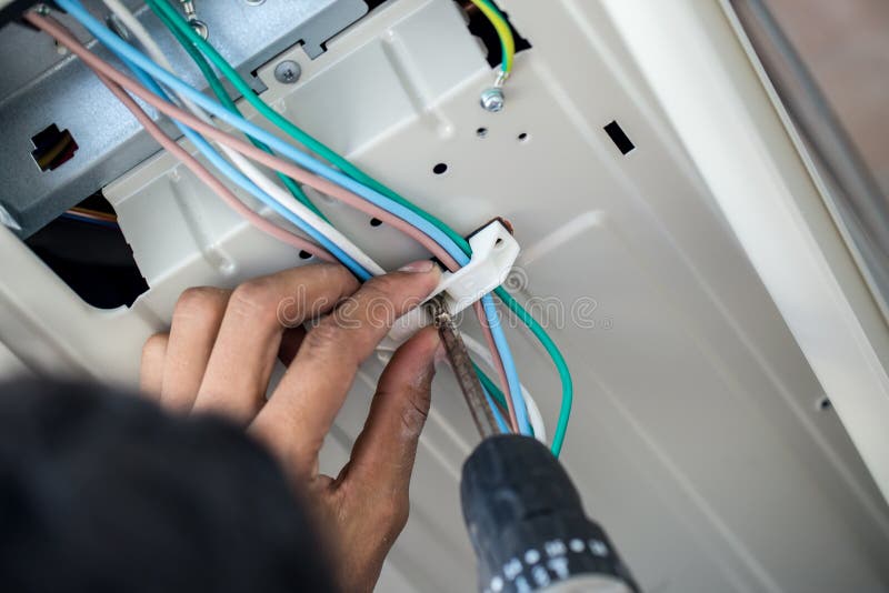 Hands of Technician is Using an Electric Motor To Tighten the Nut Stock ...