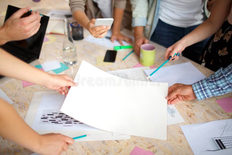 Hands Toghether with Paper. Team Work in Office. Successful Concept ...