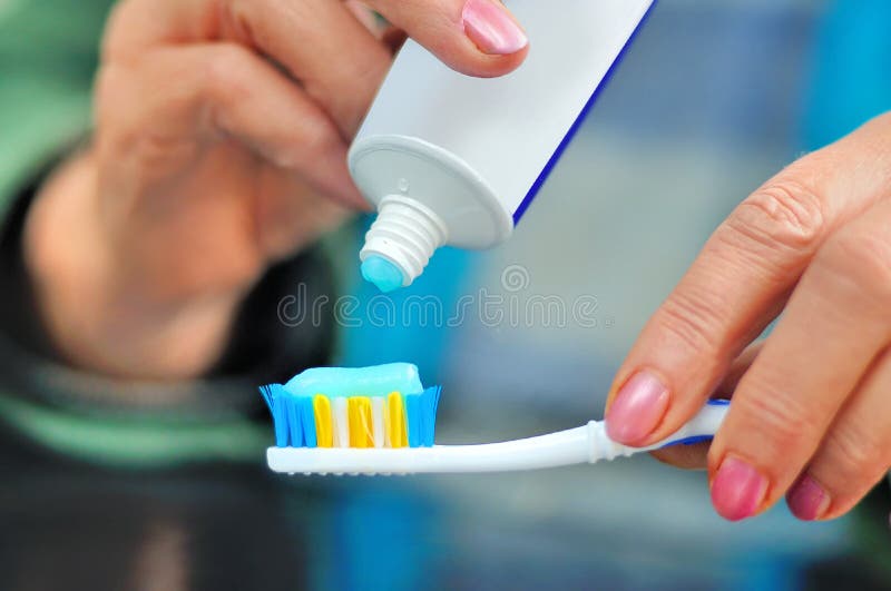 Hands with Toothbrush Hold a Tube with Toothpaste Stock Photo - Image ...