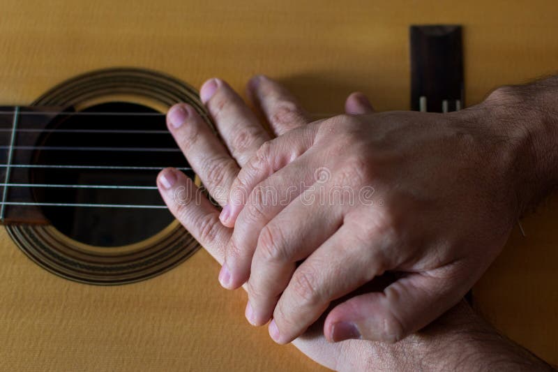 Hands on Top of a Classical Guitar Stock Photo - Image of closeup ...