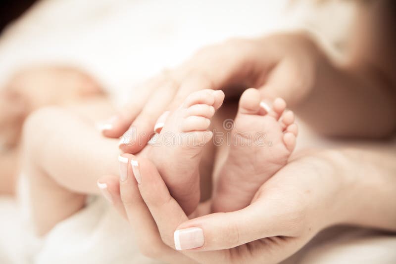 Hands touch child s feet stock image. Image of save, health - 19509277