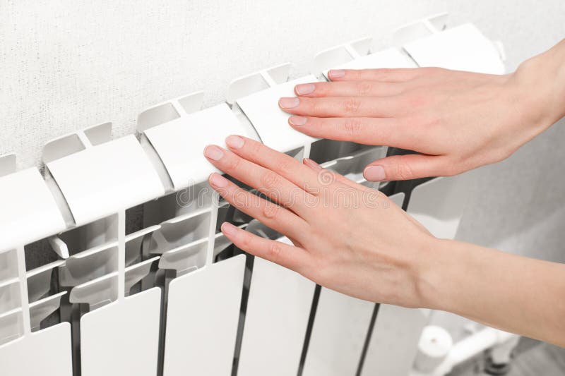 Hands Touch the Heating Radiator Stock Image - Image of heating, hands ...