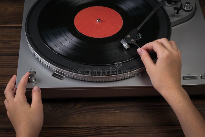 Hands Turn on Music Playback on Vinyl Disc Players. Stock Image - Image ...