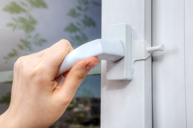 Hands Turning Handle of Plastic Window on Which Opening Delimiter ...