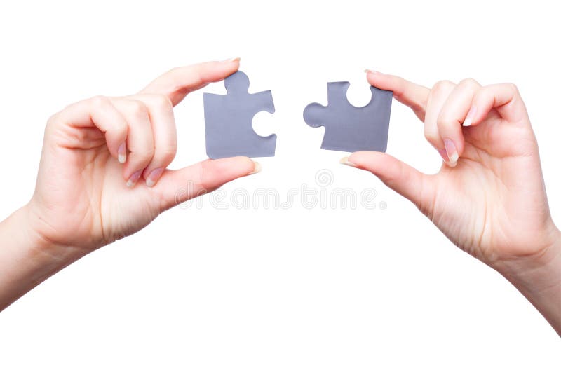 Hands Trying To Fit Two Puzzle Pieces Together Stock Image - Image of ...